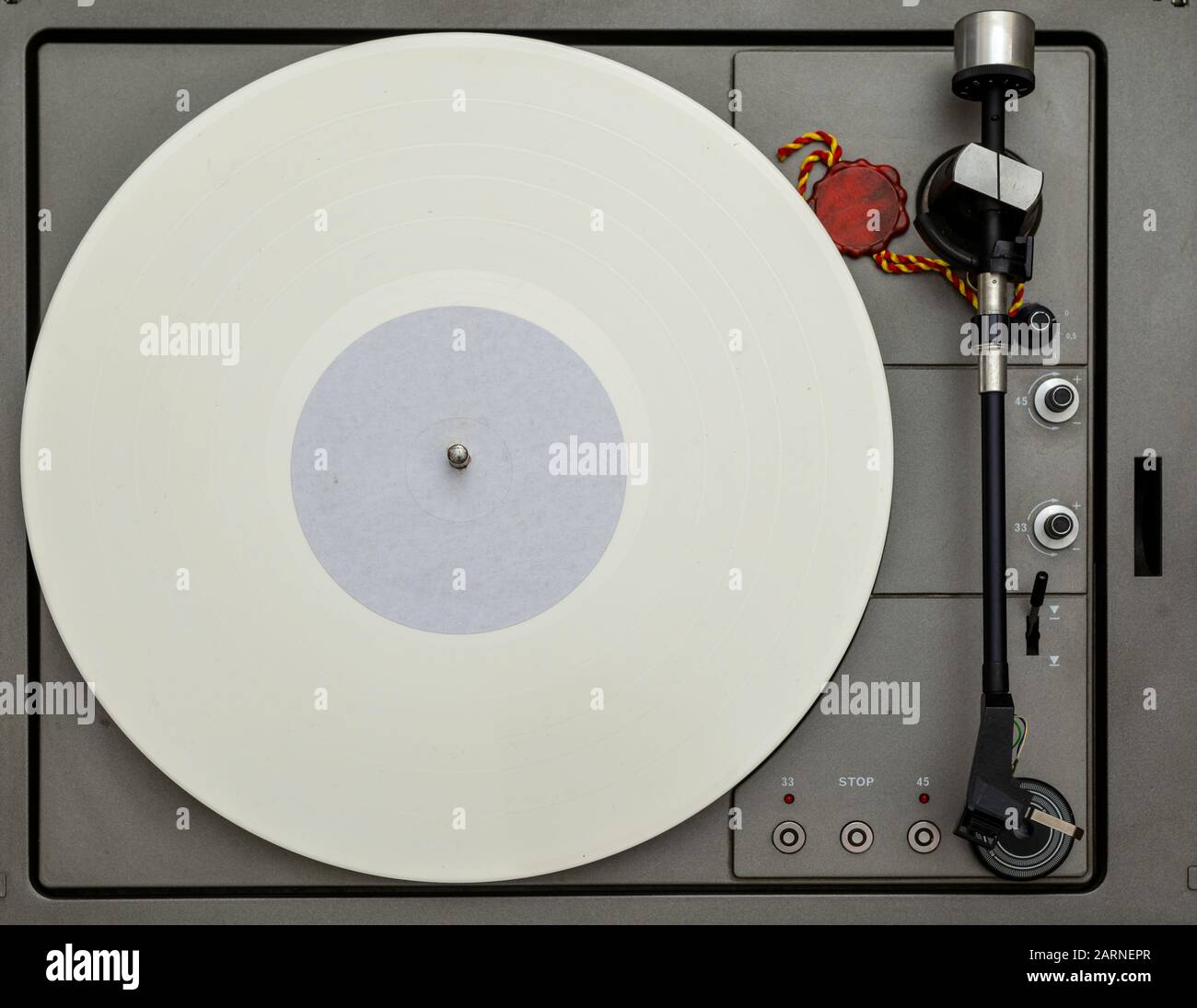 Vintage vinyl turntable with vinyl plate. Listen to music. Top view ...
