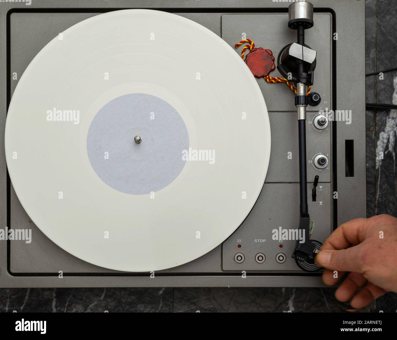 Vintage vinyl turntable with vinyl plate. Listen to music. Top view ...