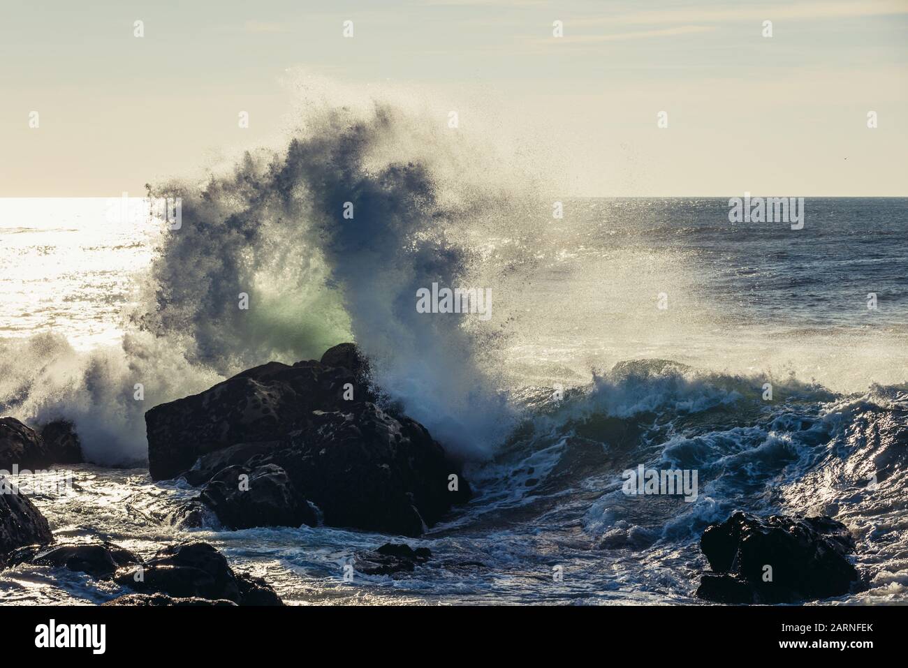 Atlantic Ocean wave crashing into rocks of shore of Nevogilde civil ...