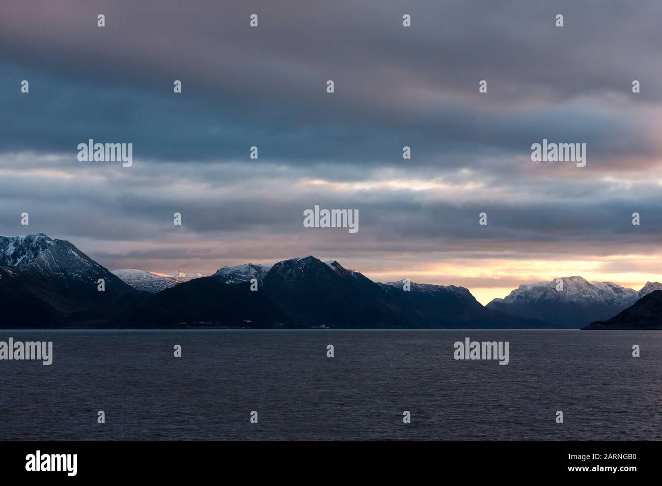 Evening approaching over the entrance to the Øksfjorden, Loppa ...