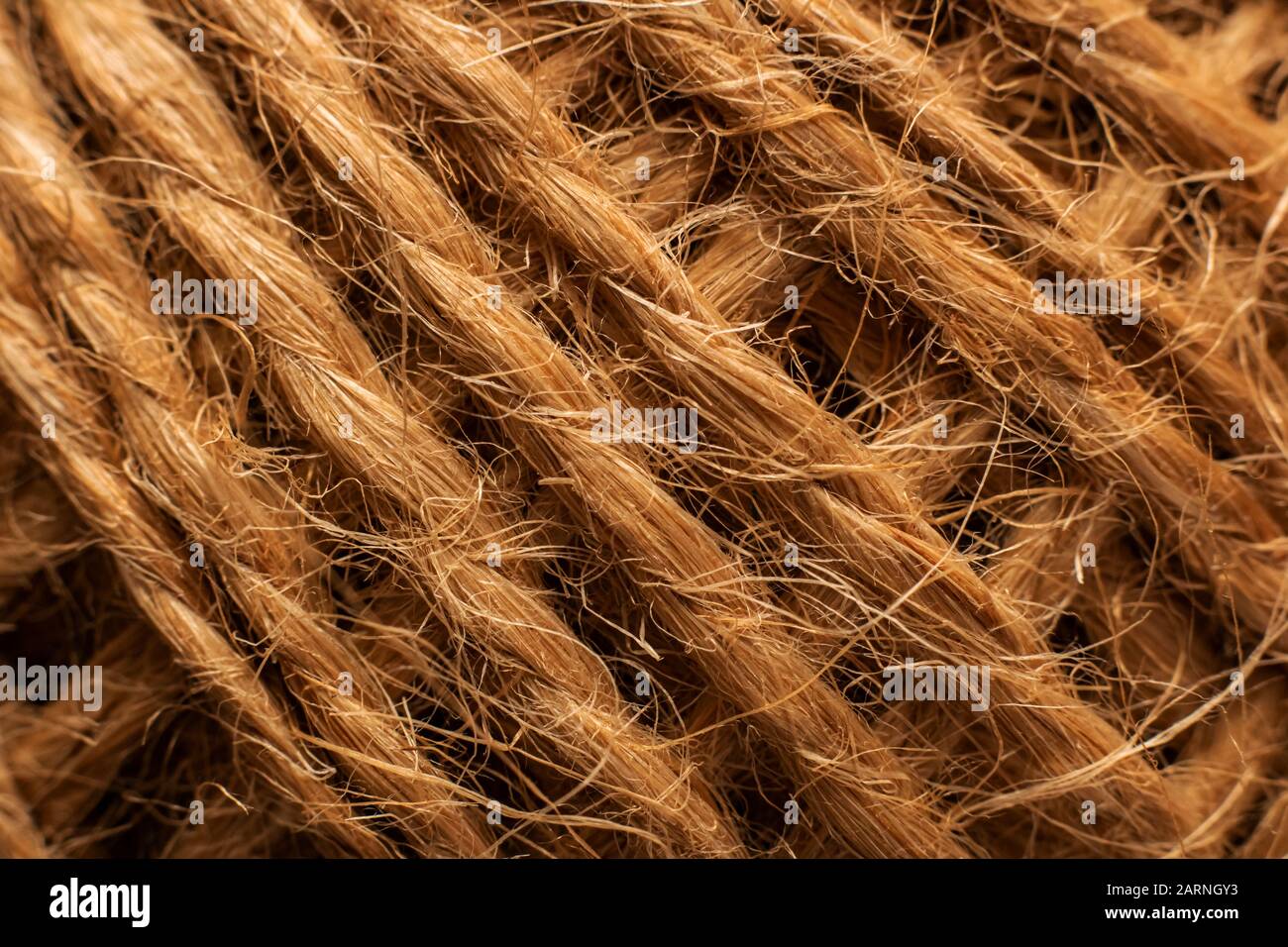 Skein of twisted yellow rope close up Stock Photo - Alamy