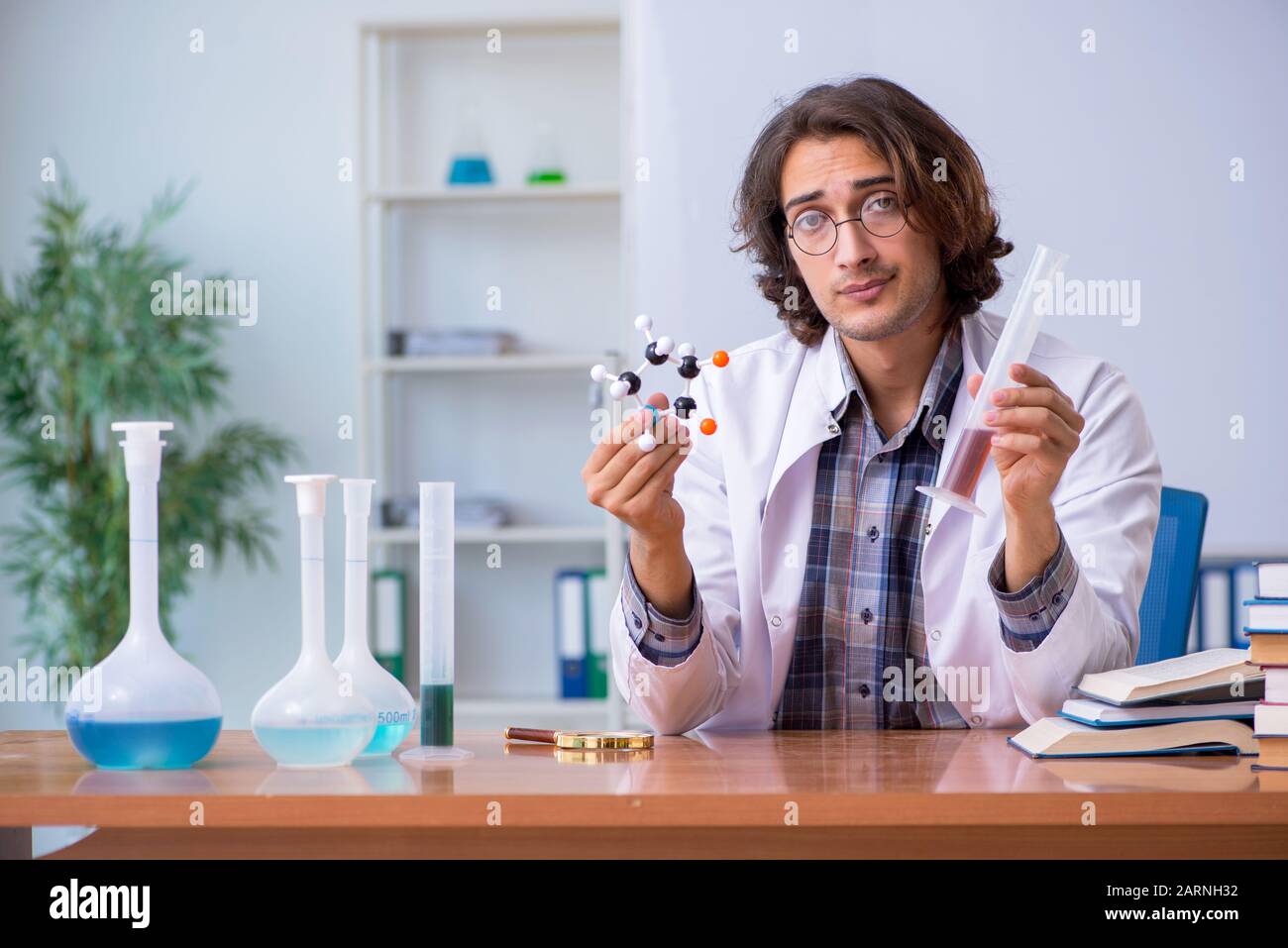 The chemistry lecturer during lecture in college Stock Photo - Alamy