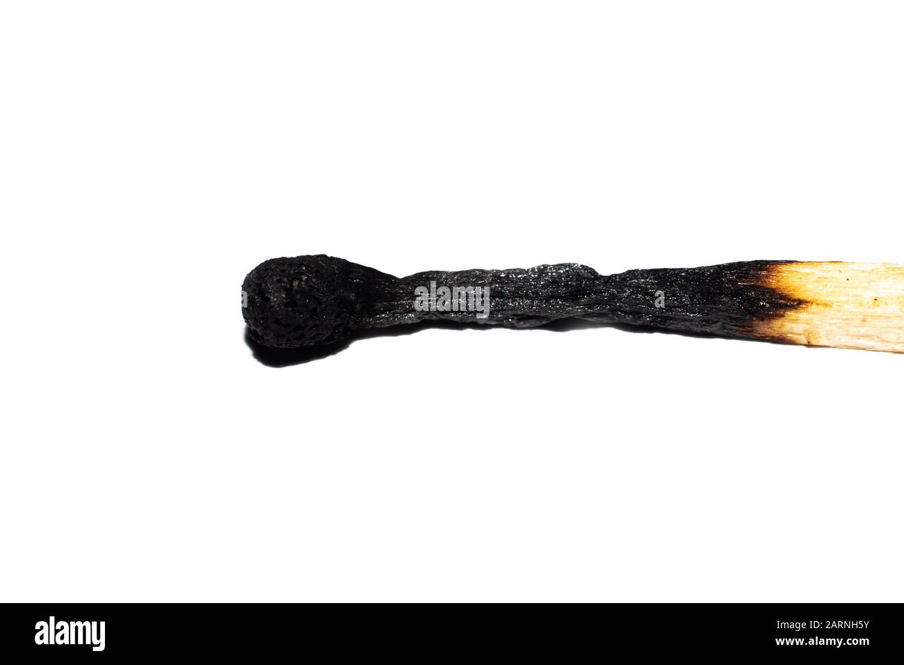 Black head of a burnt match close up, isolated Stock Photo - Alamy