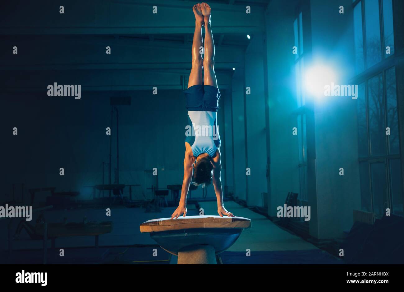 Little male gymnast training in gym, flexible and active. Caucasian fit ...
