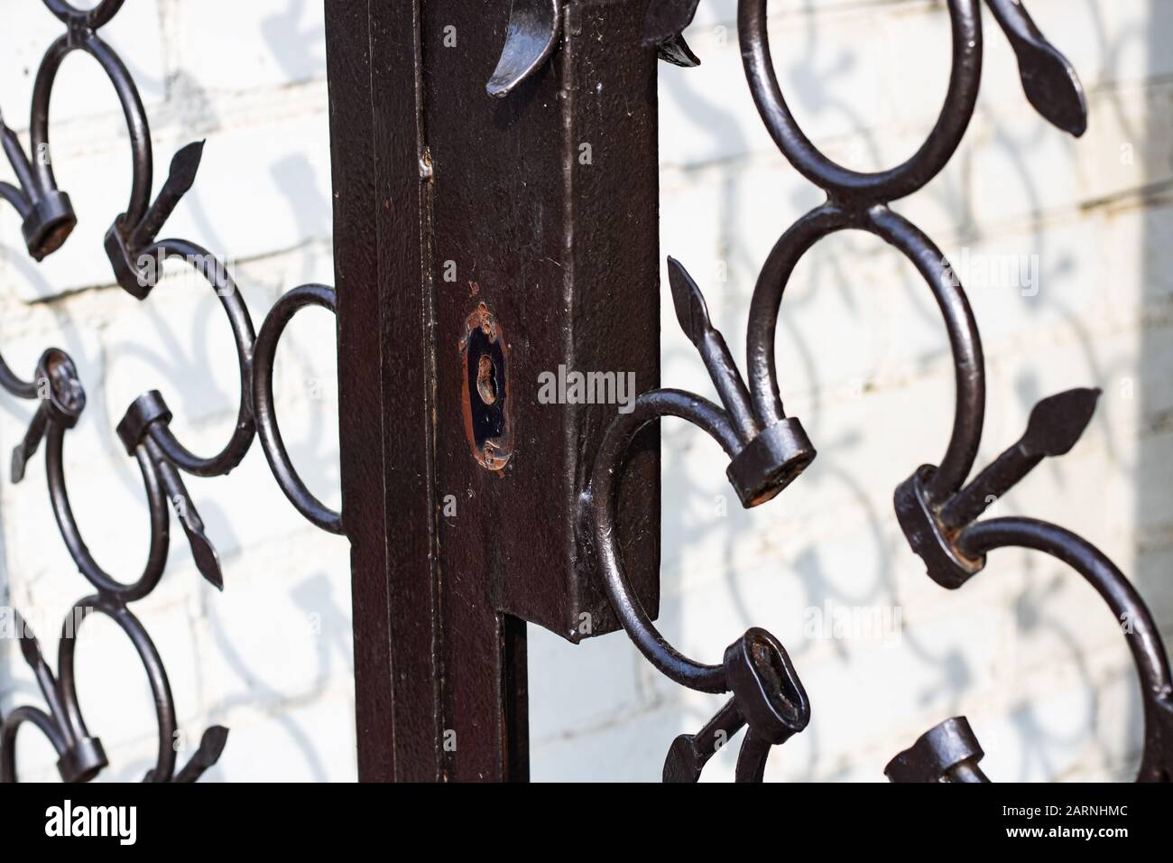 Keyhole on a metal forged fence Stock Photo - Alamy