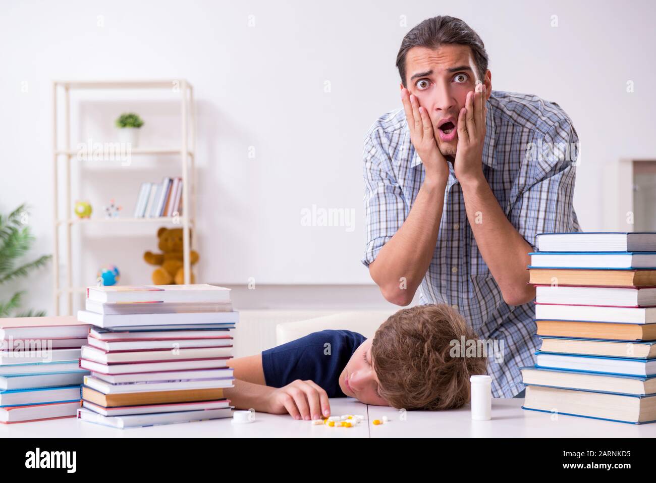 The young student stressed due to excessive studies Stock Photo - Alamy