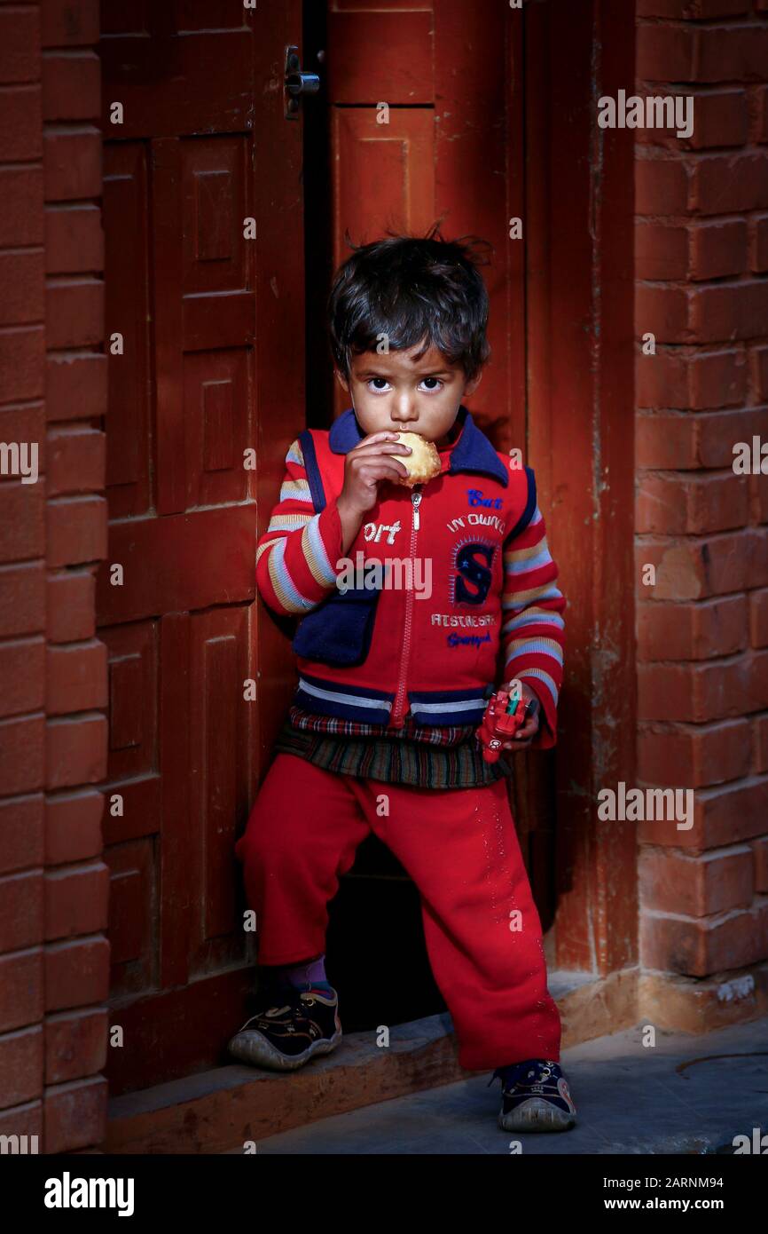 cute small Indian boy eating Stock Photo - Alamy