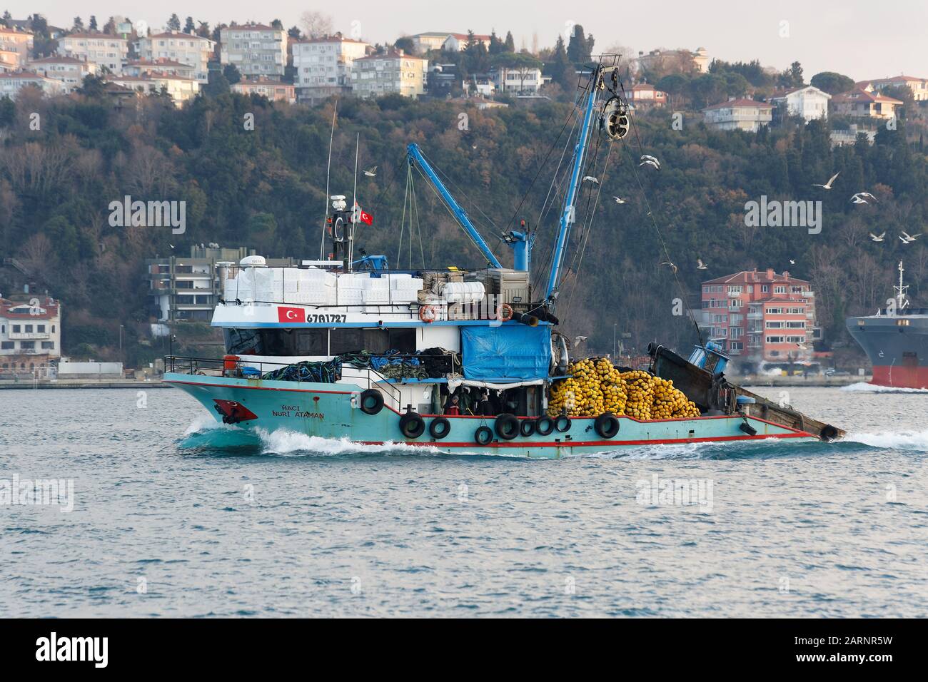 Trawler type commercial fishing boat with ice pack fish containers ...