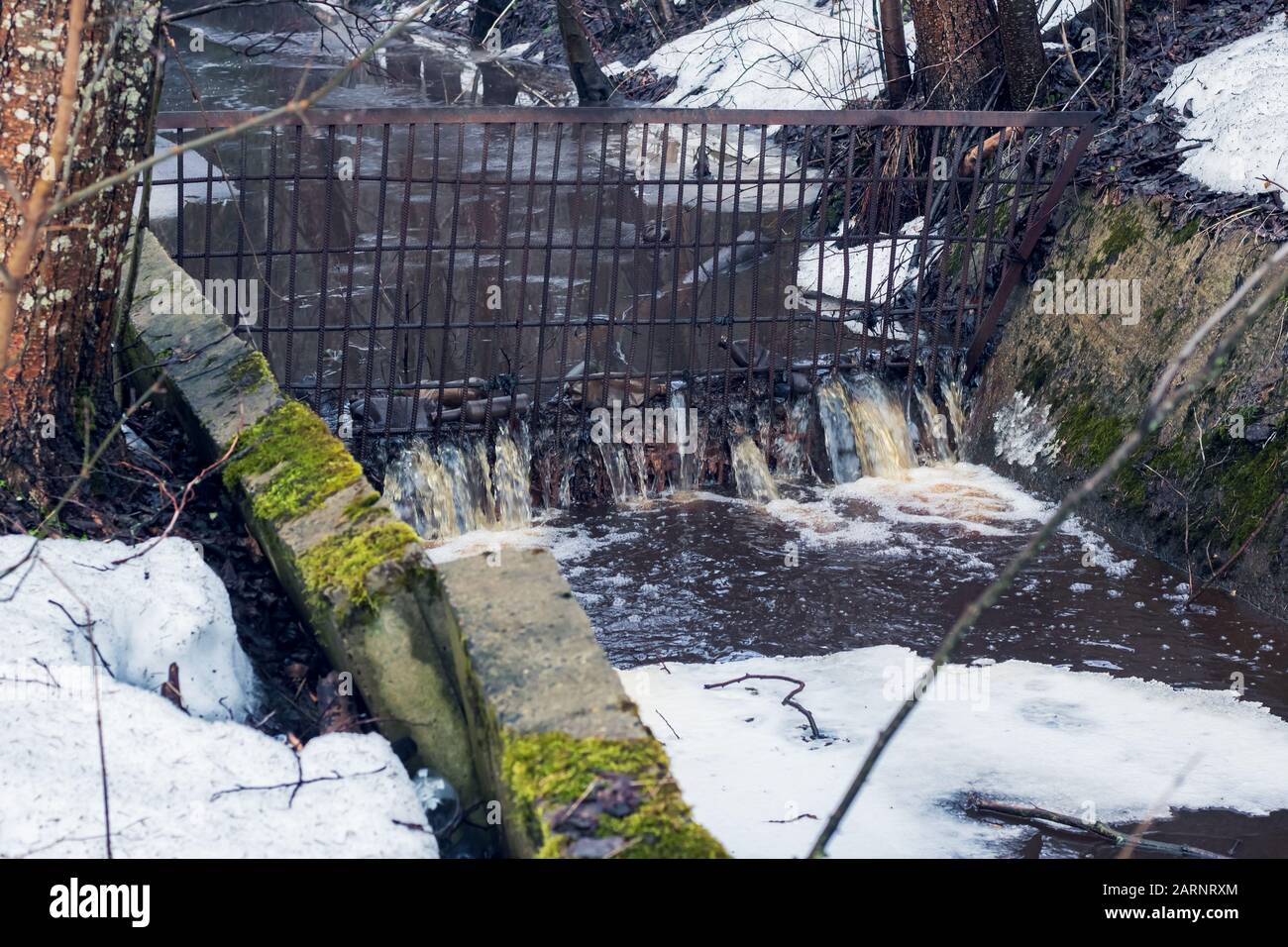 Small waterfall on the old dirty river Stock Photo - Alamy