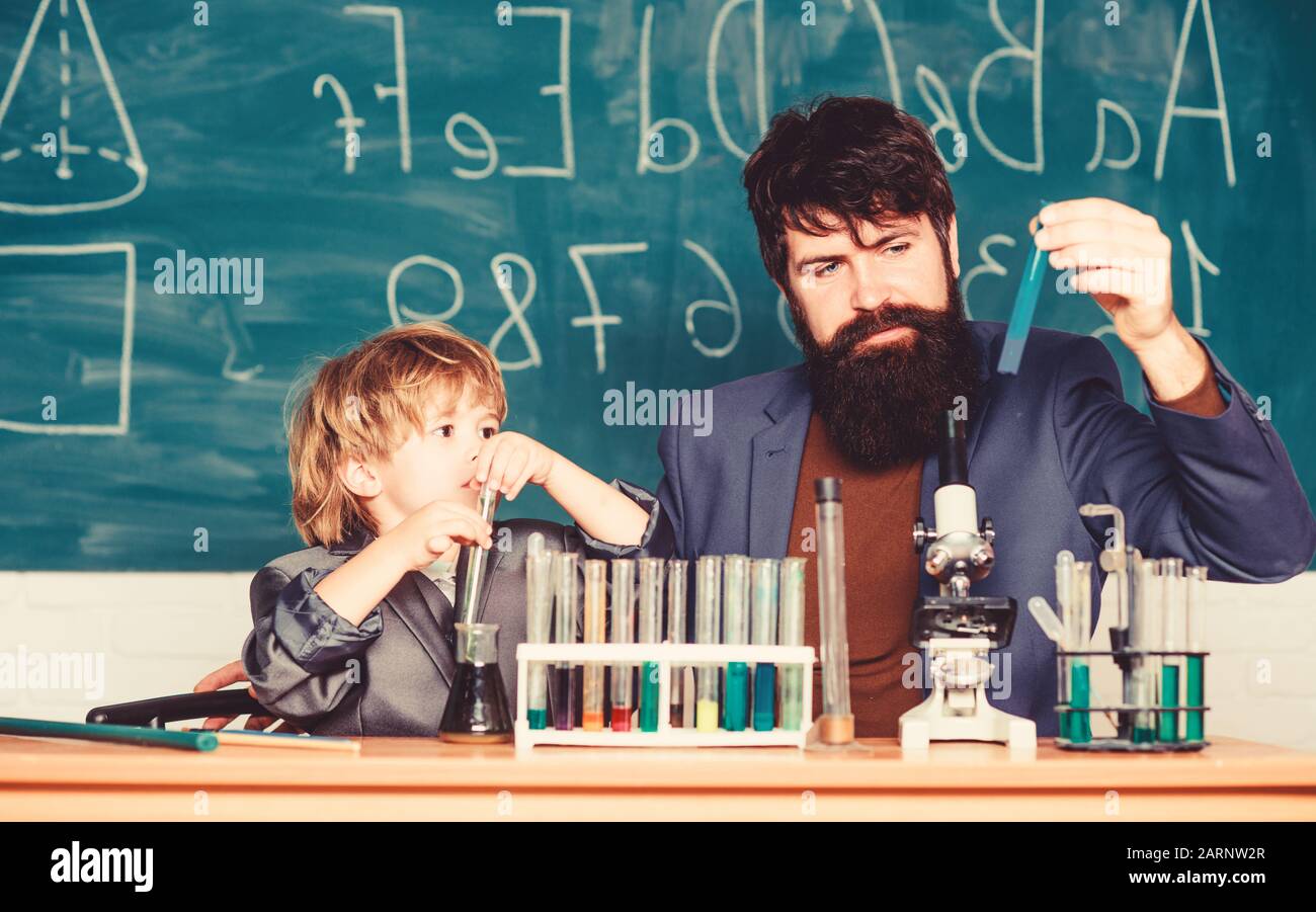 Strength On Your Side. Little kid learning chemistry in school ...