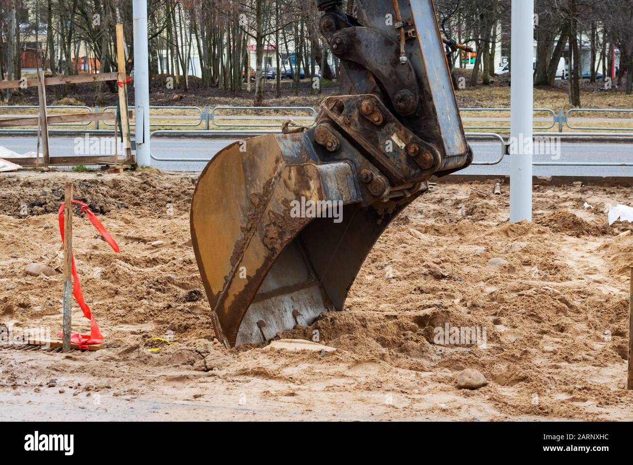 Excavator scoop close up on a construction site Stock Photo - Alamy