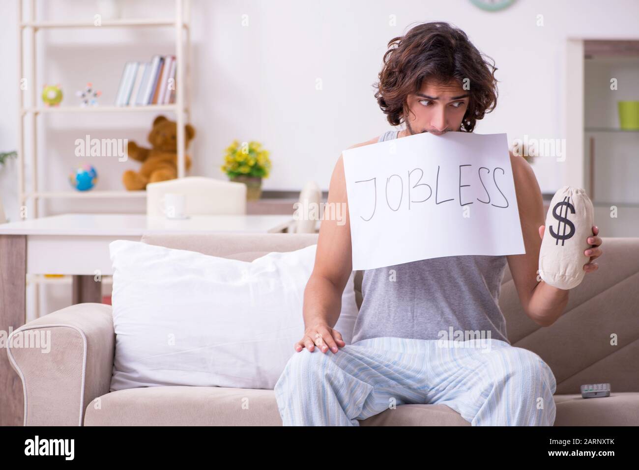 The unemployed man desperate at home Stock Photo - Alamy