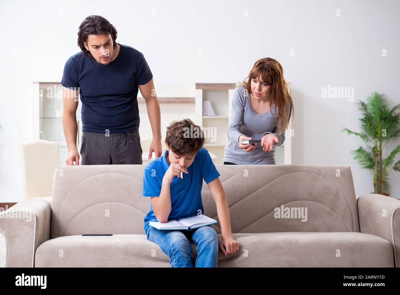 The concept of underage smoking with young boy and family Stock Photo ...