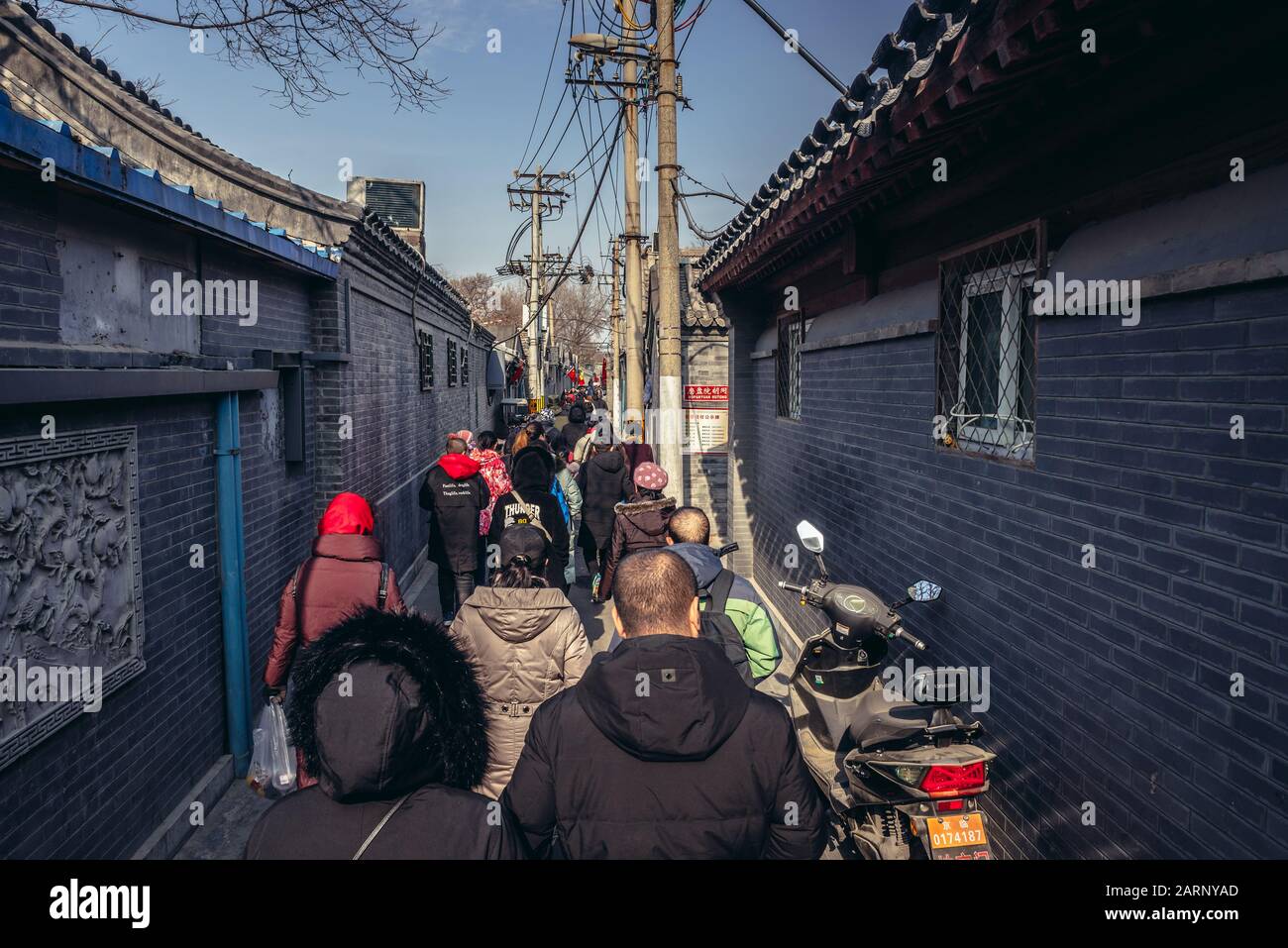 People walks in traditional hutong alley in Beijing, China Stock Photo ...
