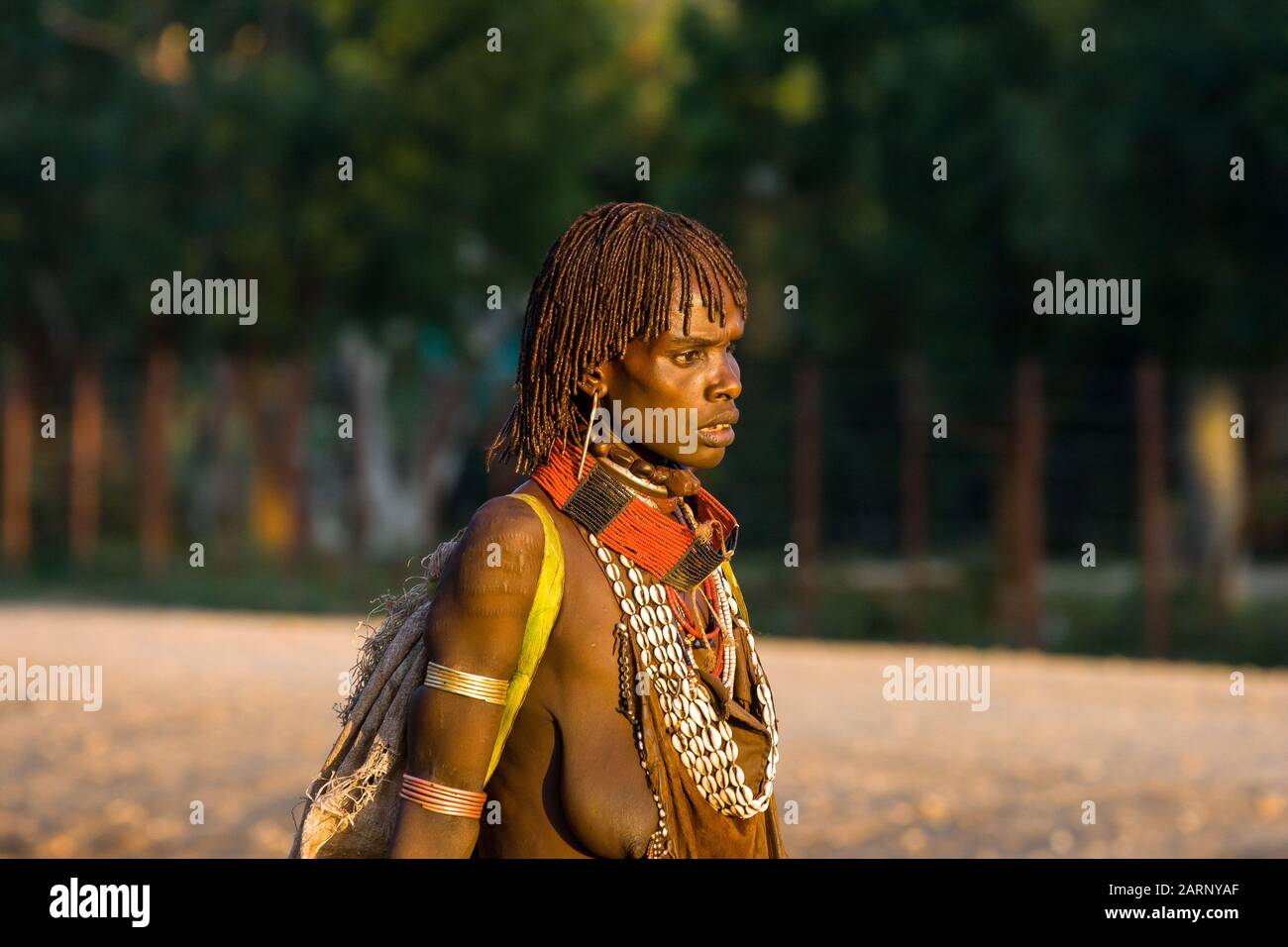 Hamer woman crossing the road in Dimeka village, Omo river valley ...