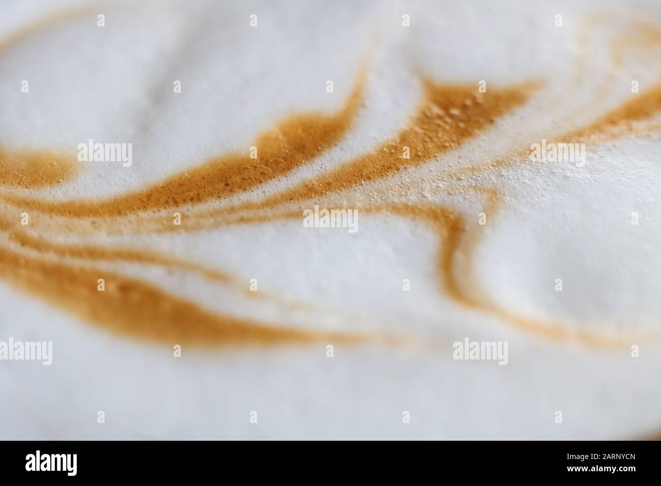 Drawing on white crema from coffee close up Stock Photo - Alamy