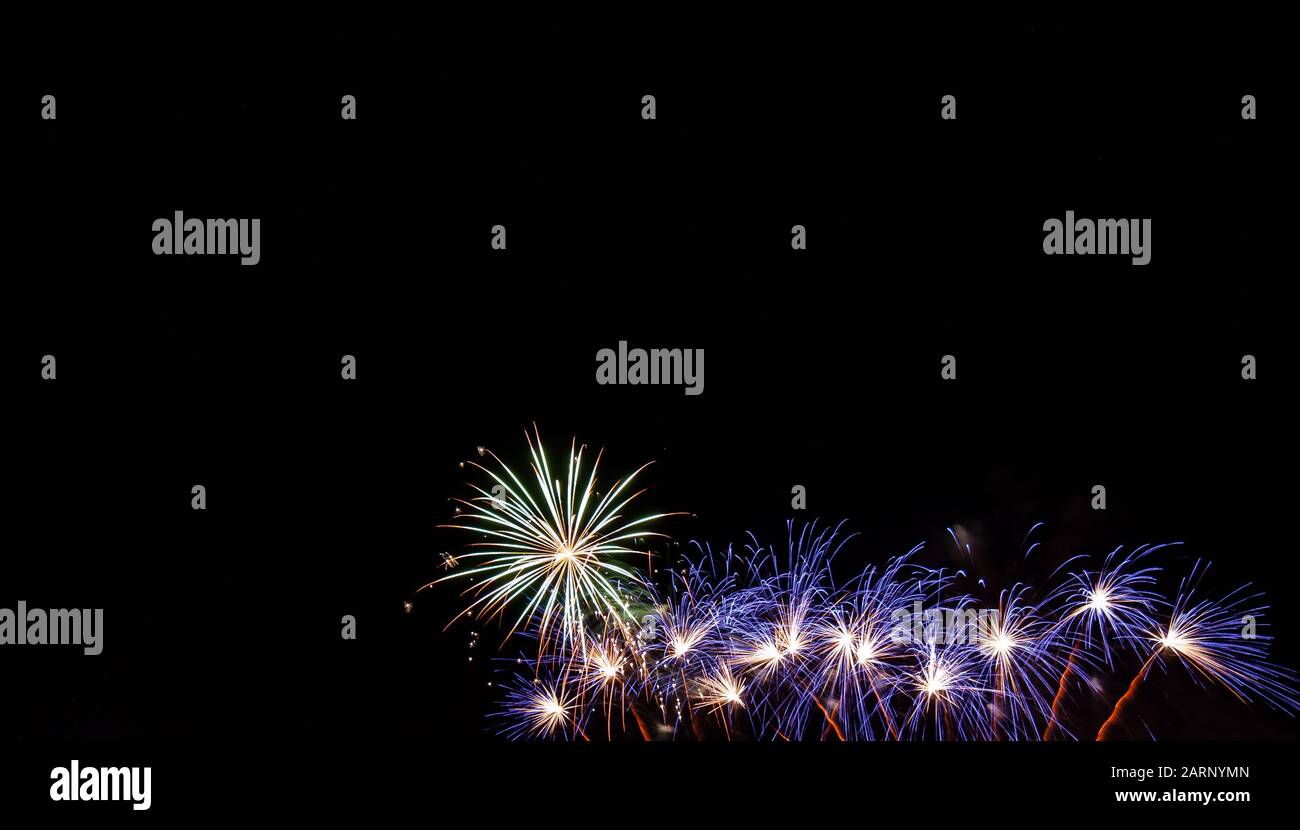 Orange fireworks in midnight sky hi-res stock photography and images ...