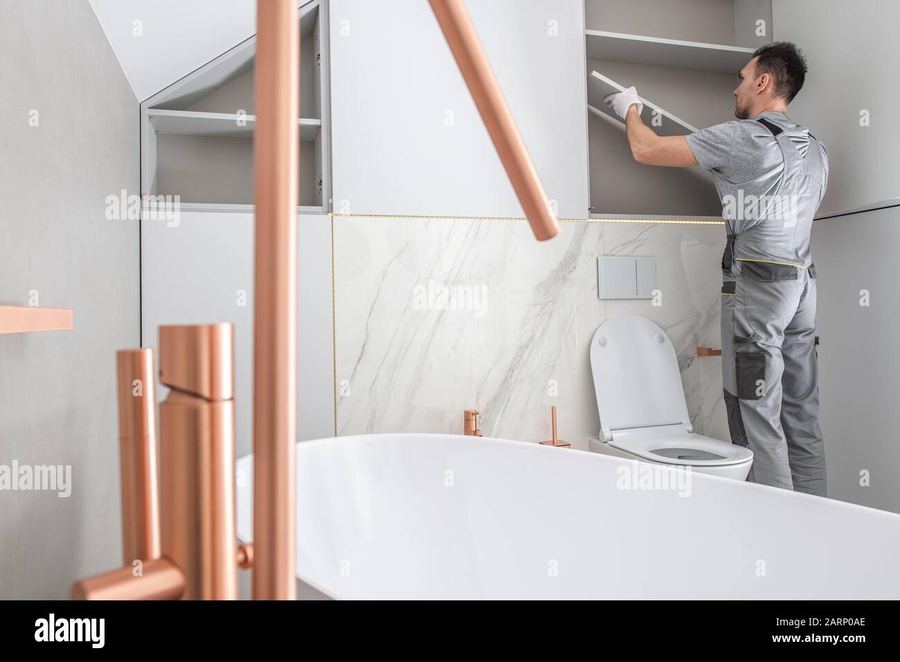 Bathroom Storage Building by Caucasian Home Improvement Worker. Elegant ...