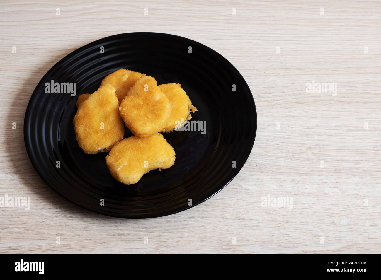 Chicken nuggets on round hi-res stock photography and images - Alamy