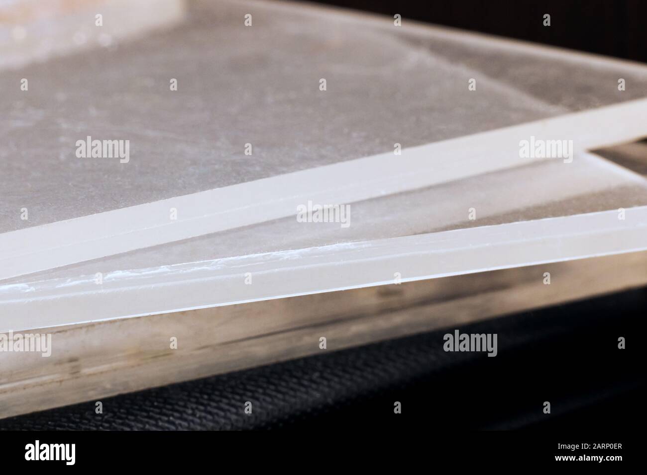 Sheets of chopped glass close up on black background Stock Photo - Alamy