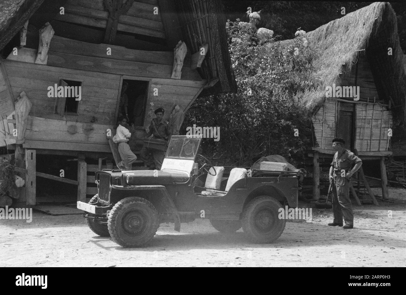 Tapanoeli A jeep stands for typical Batak houses. A Dutch cavalry ...