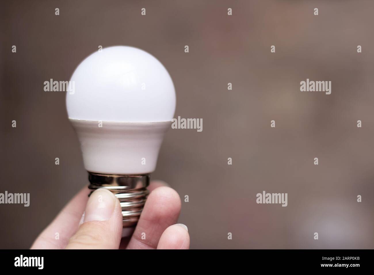 Incandescent bulb in hand hi-res stock photography and images - Alamy