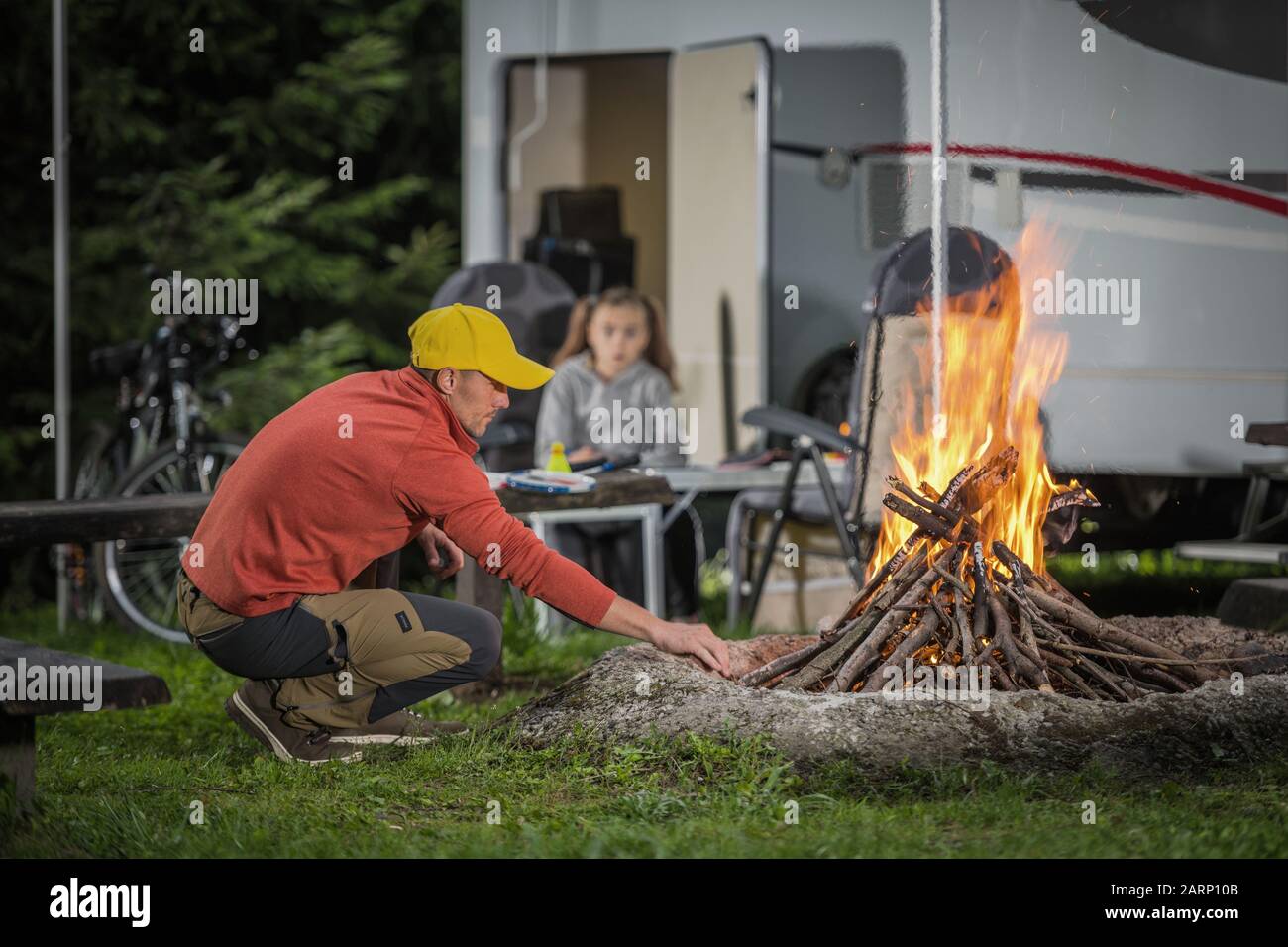 RV Camping Campfire in Front of Motorhome Pitch. Summer Vacation with ...