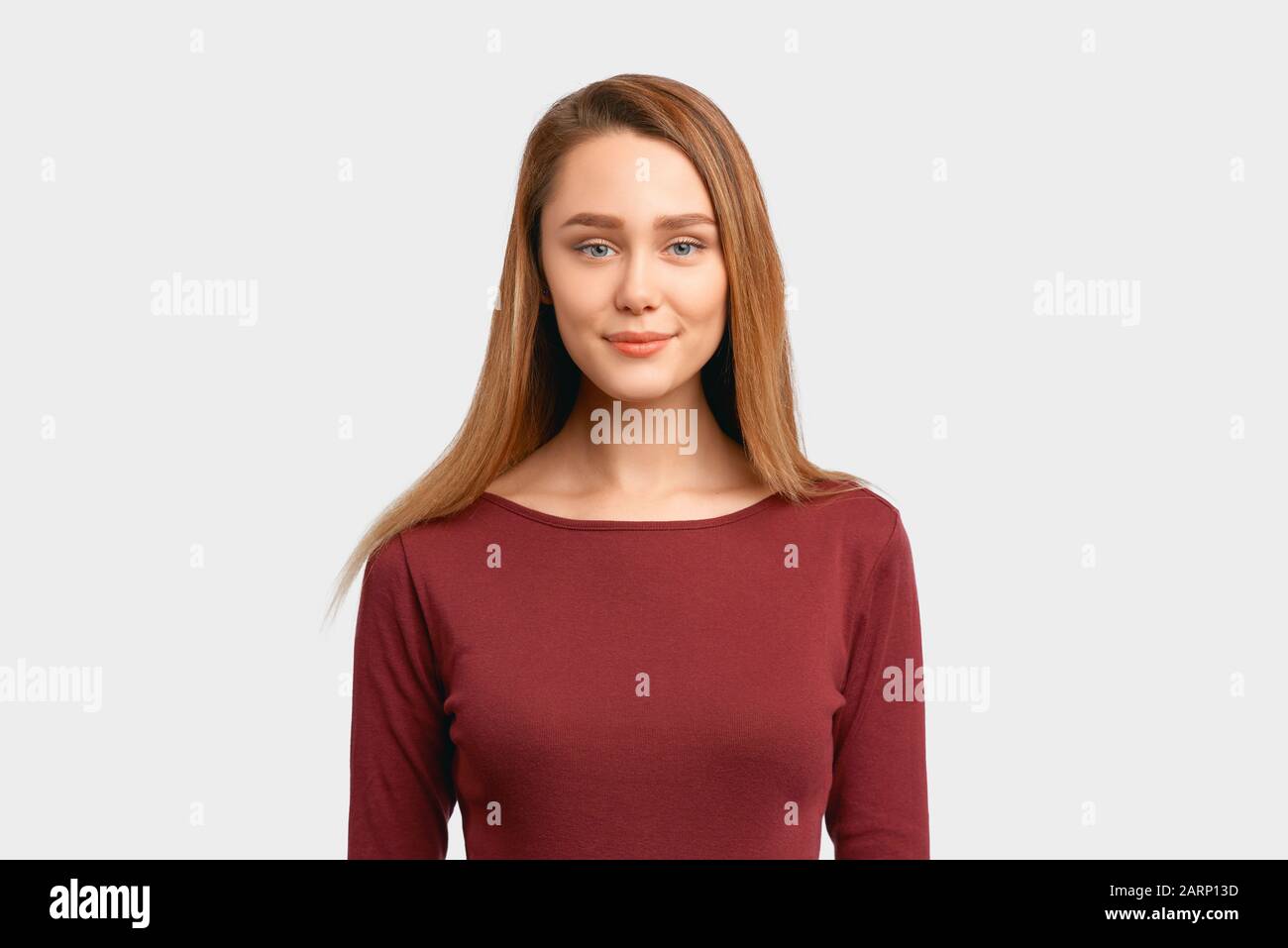 Sweet looking girl looks at camera, gentle smile Stock Photo - Alamy