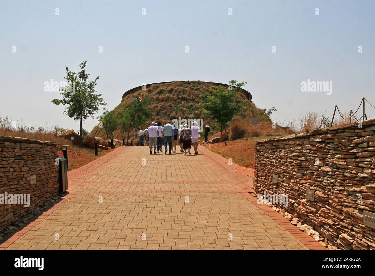 Tourists walking ino the front entrance of The Cradle of Humankind ...