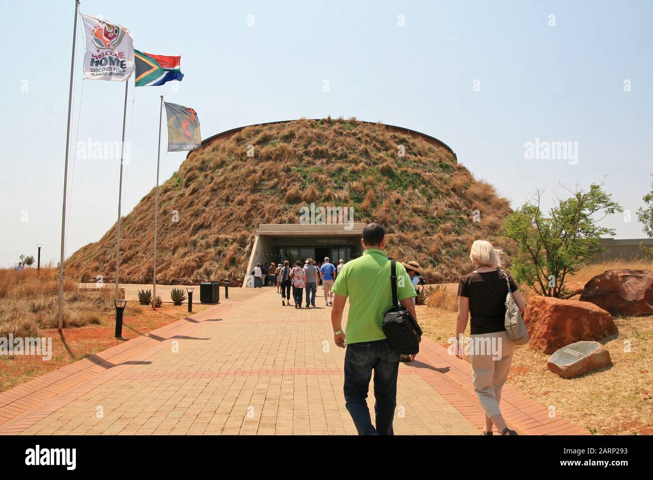 Tourists walking ino the front entrance of The Cradle of Humankind ...