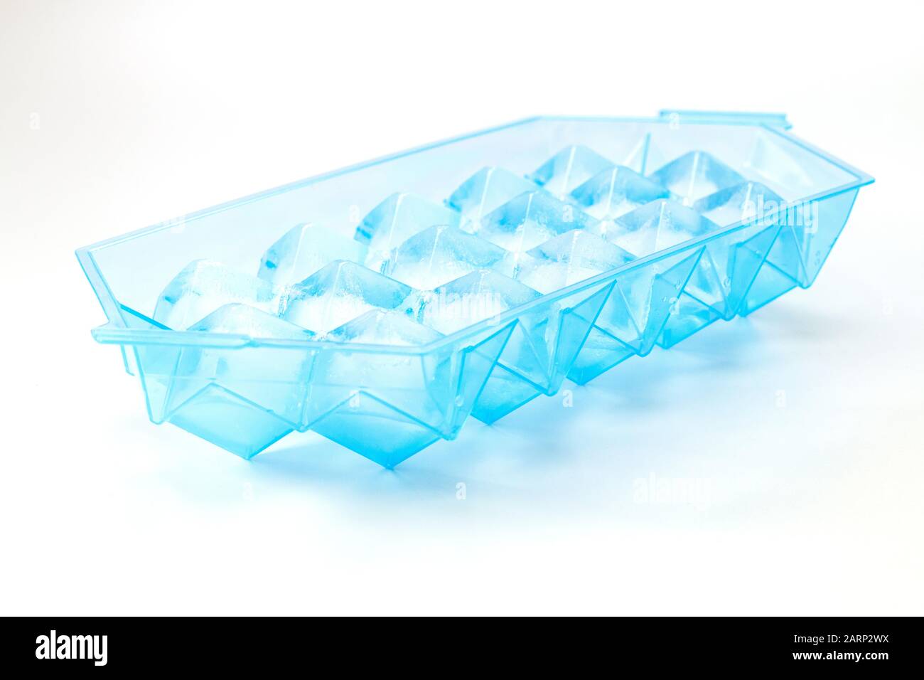 reusable plastic ice maker with ice cubes isolated on white background ...