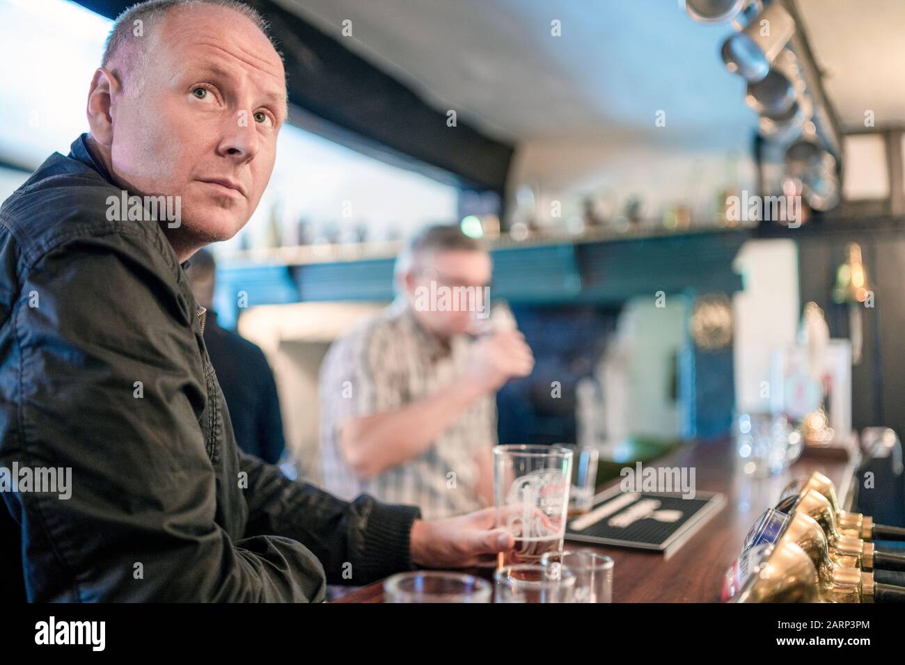 Man enjoying his beer in British pub, United Kingdom Stock Photo - Alamy