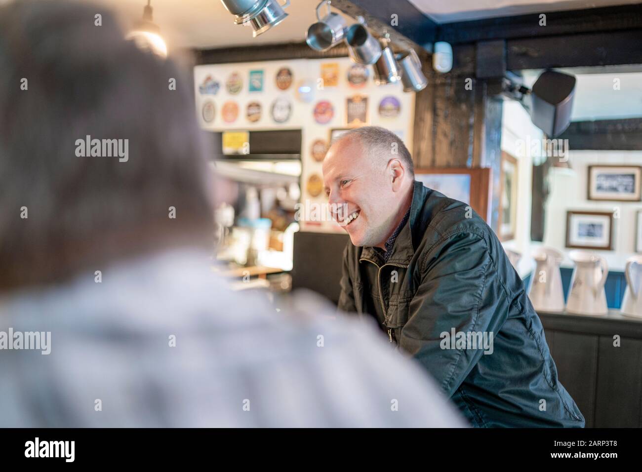 Man enjoying his beer in British pub, United Kingdom Stock Photo - Alamy