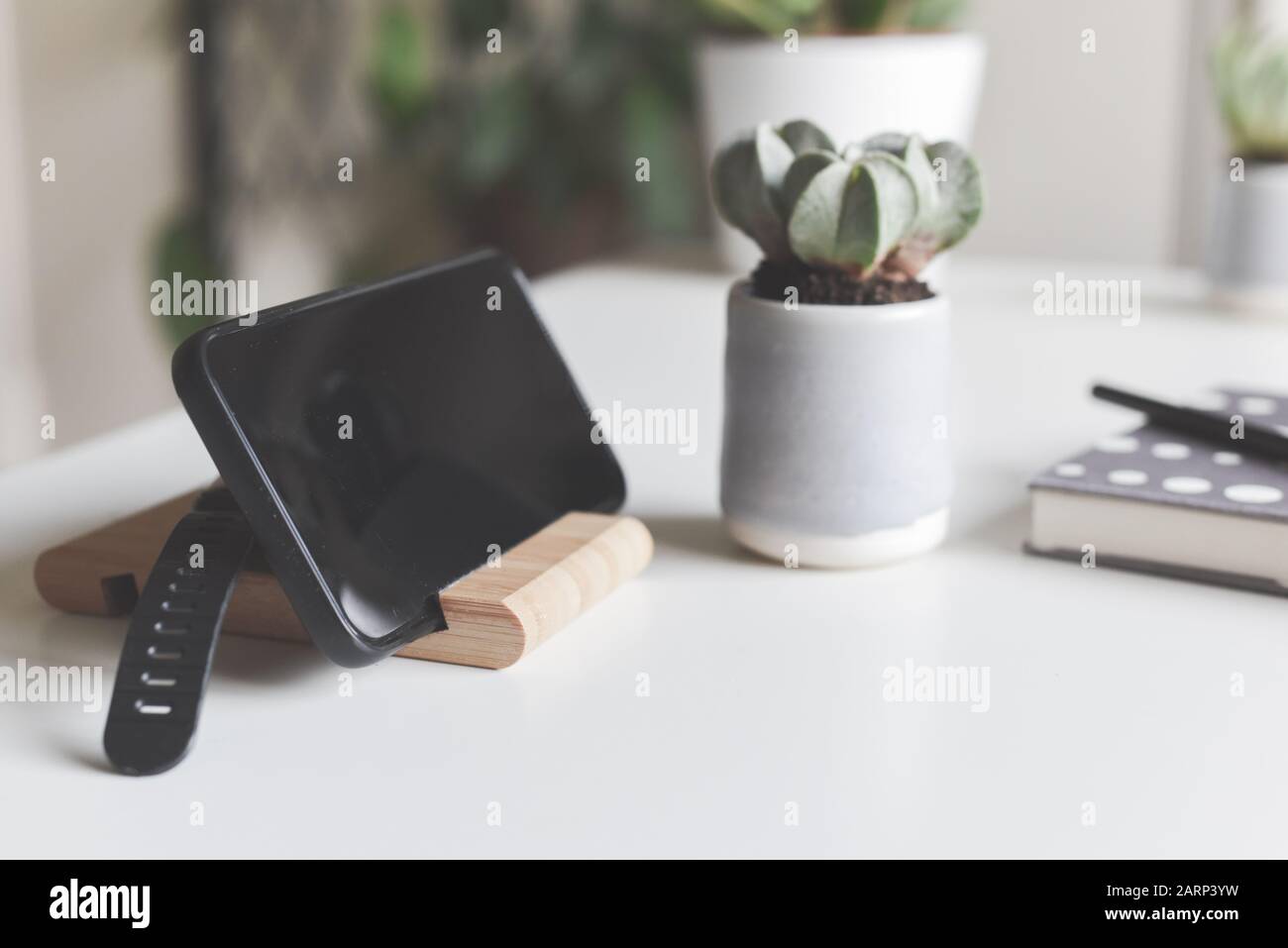 Office objects on a white desk in light modern style with copy space ...