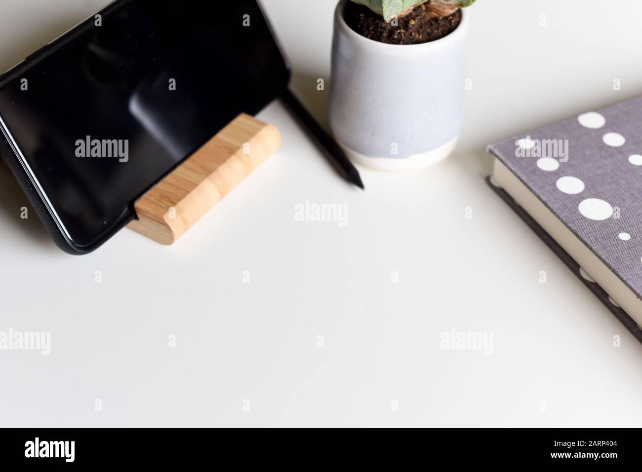 Office objects on a white desk in light modern style with copy space ...