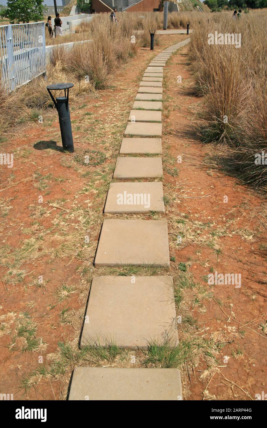 Back of the main museum of The Cradle of Humankind from stone path in ...
