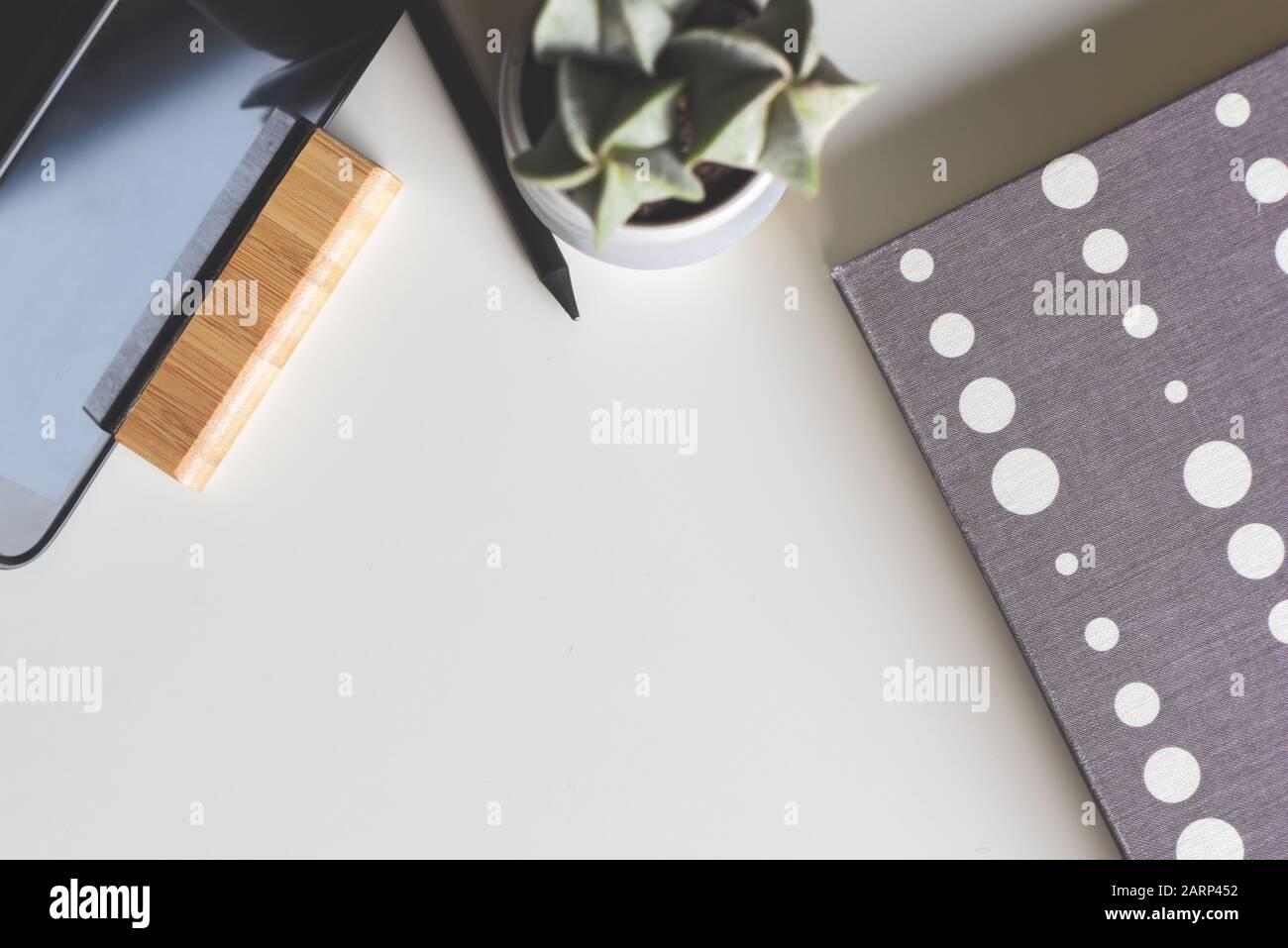 Office objects on a white desk in light modern style with copy space ...