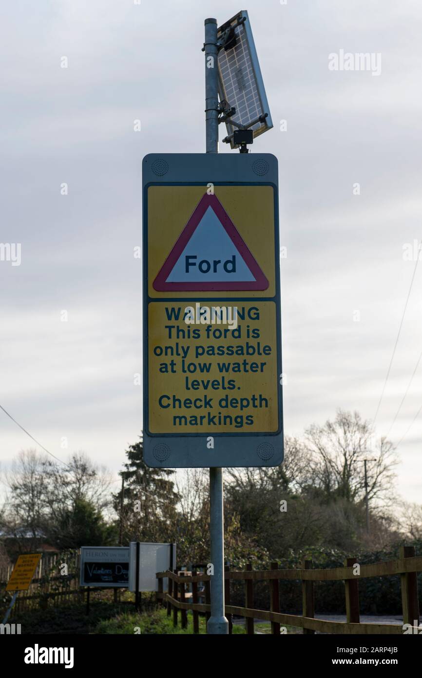 Warning signs at river ford, river crossing Stock Photo - Alamy