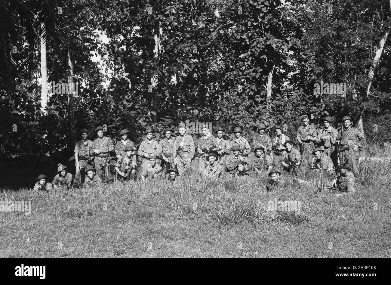 Dutch military unit, partly in camouflage uniform,, poses for a group ...