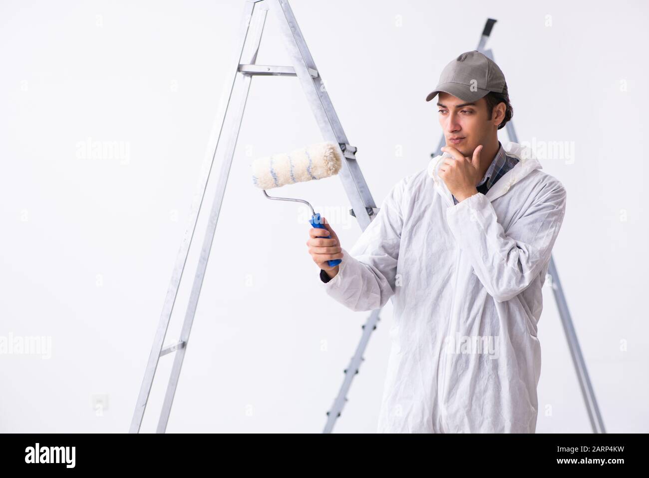 Painter working at the construction site Stock Photo - Alamy