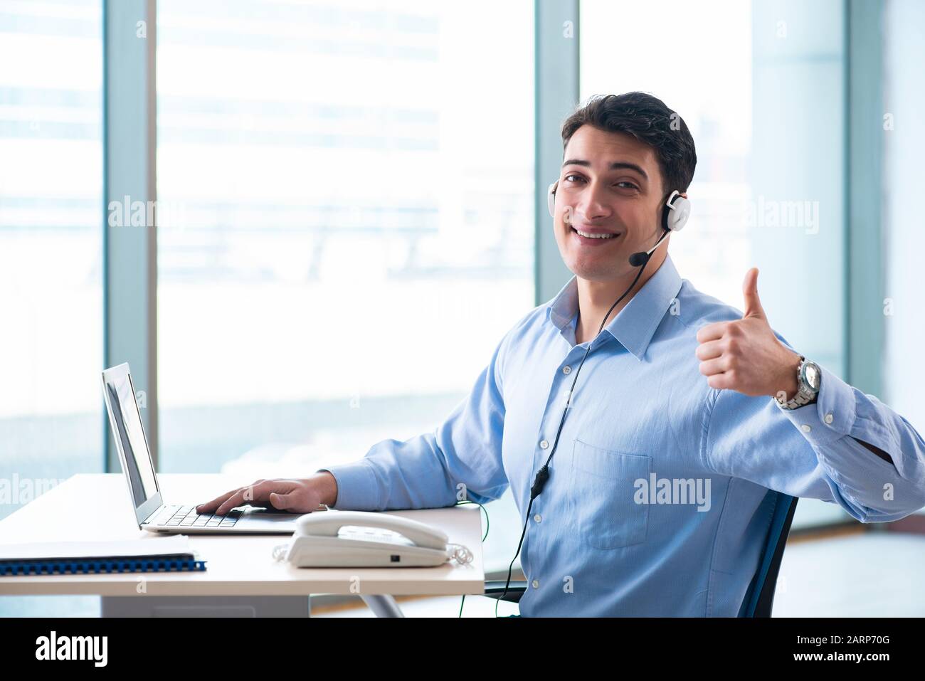 Call center giving thumbs up hi-res stock photography and images - Alamy