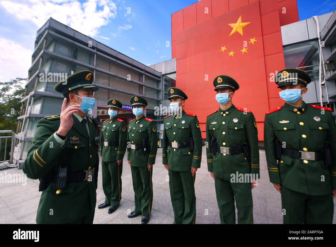 Chinese paramilitary policemen wearing face masks for prevention of the ...