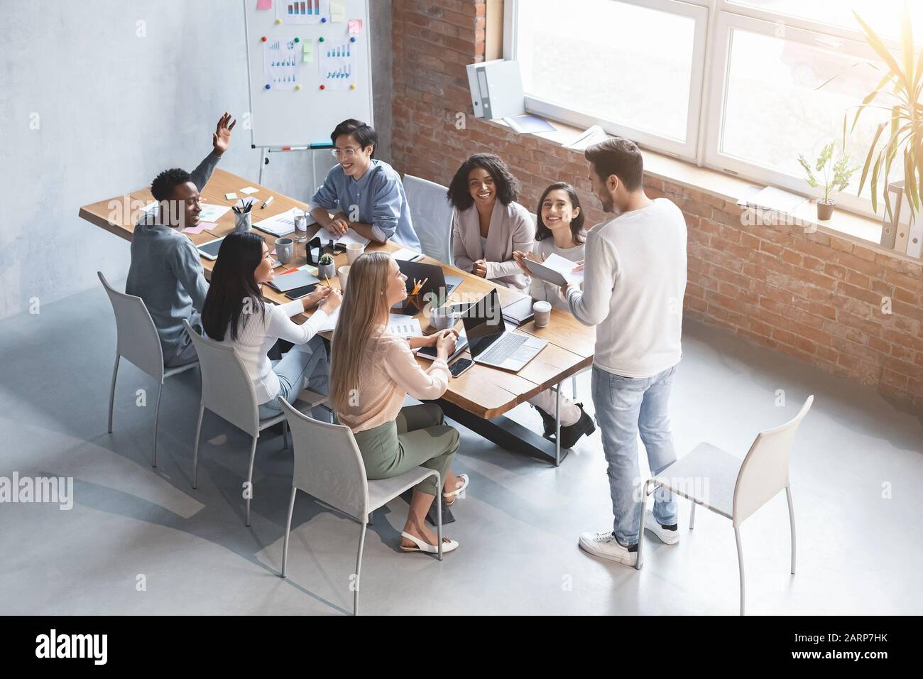 Multiethnic group of employees having business meeting discussion Stock ...