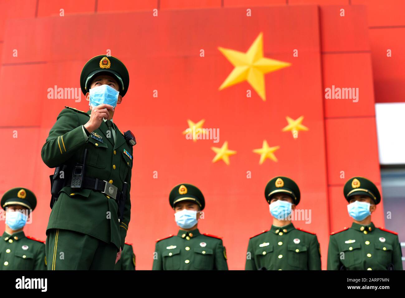 Chinese paramilitary policemen wearing face masks for prevention of the ...