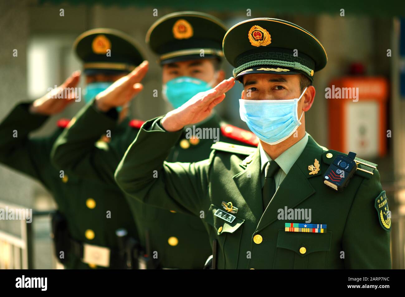 Chinese paramilitary policemen wearing face masks for prevention of the ...