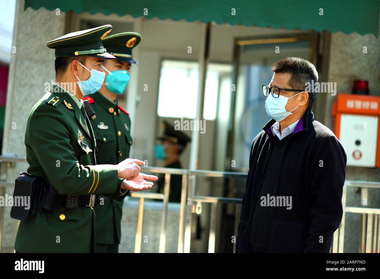 Chinese paramilitary policemen wearing face masks for prevention of the ...