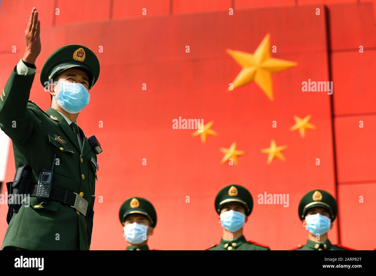 Chinese paramilitary policemen wearing face masks for prevention of the ...