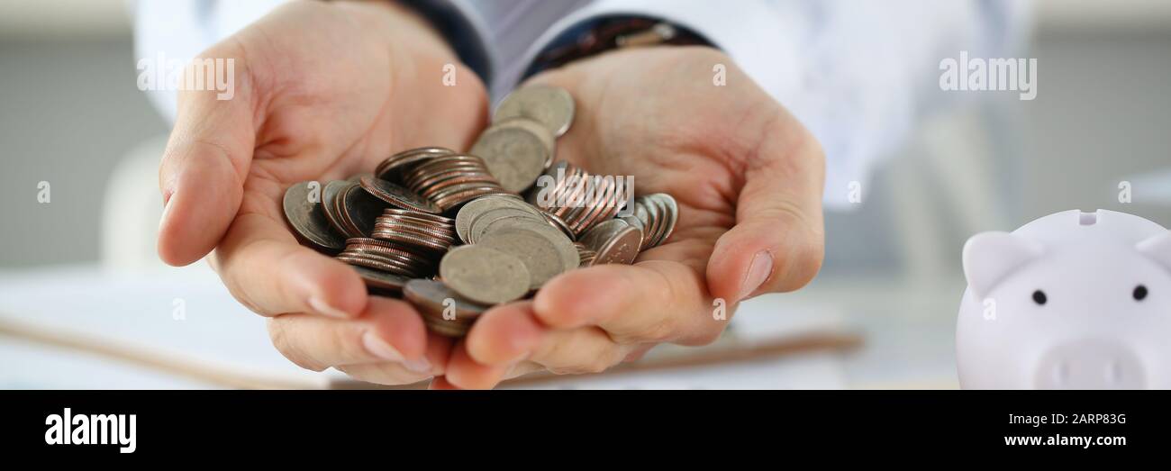 Hand businessman putting pin money Stock Photo - Alamy