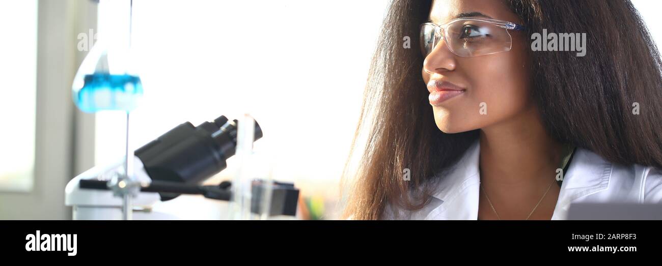 Black female chemist student conducting research Stock Photo - Alamy