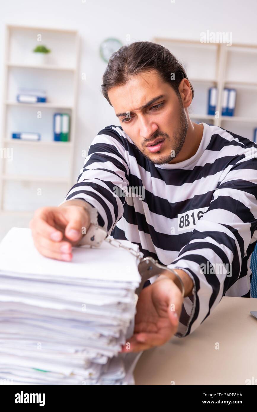 The young employee feeling like prisoner at work Stock Photo - Alamy